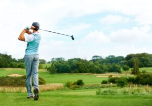 Golf Ball Below Feet: The Setup And Swing Changes You Need | MyGolfSpy