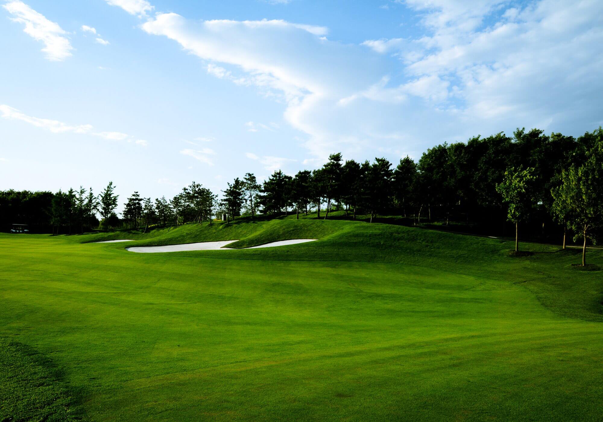 Golf Ball Below Feet: The Setup And Swing Changes You Need | MyGolfSpy